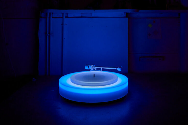 brian eno’s turntable II glows in different acrylic neon lights as the ...