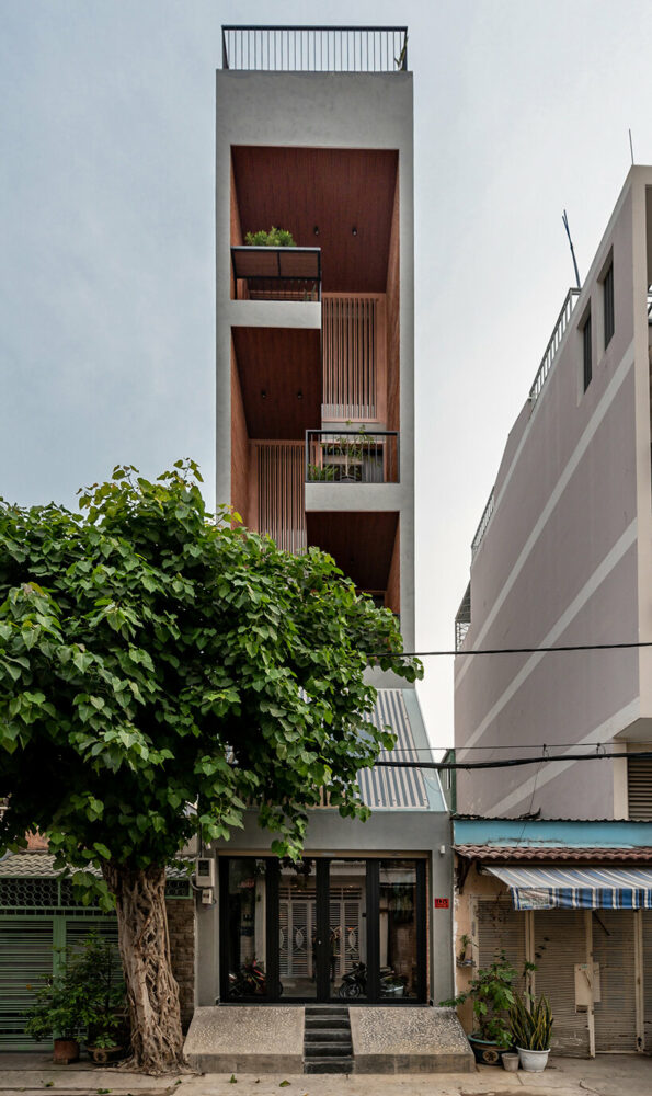 story architecture fronts narrow vietnam house with stacked terraces