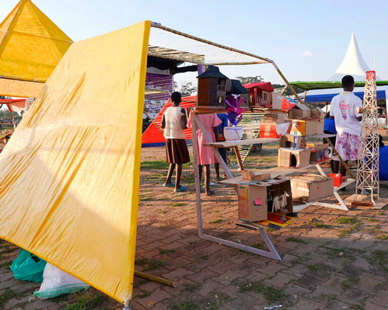 colorful angular tents shape puzzle-like zanya pavilion in uganda