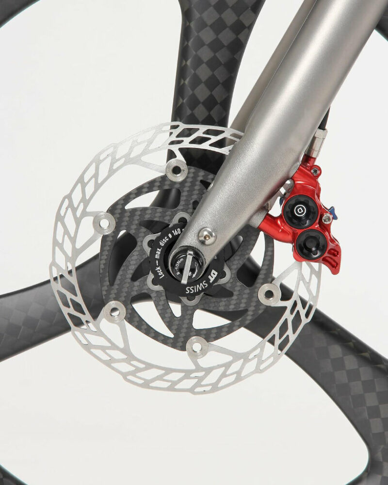 firefly’s titanium mini travel bike unfastens easily to fit in RIMOWA ...