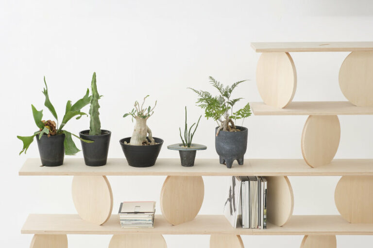 kengo kuma's modular wooden shelf with moving plates carries on ryuichi ...