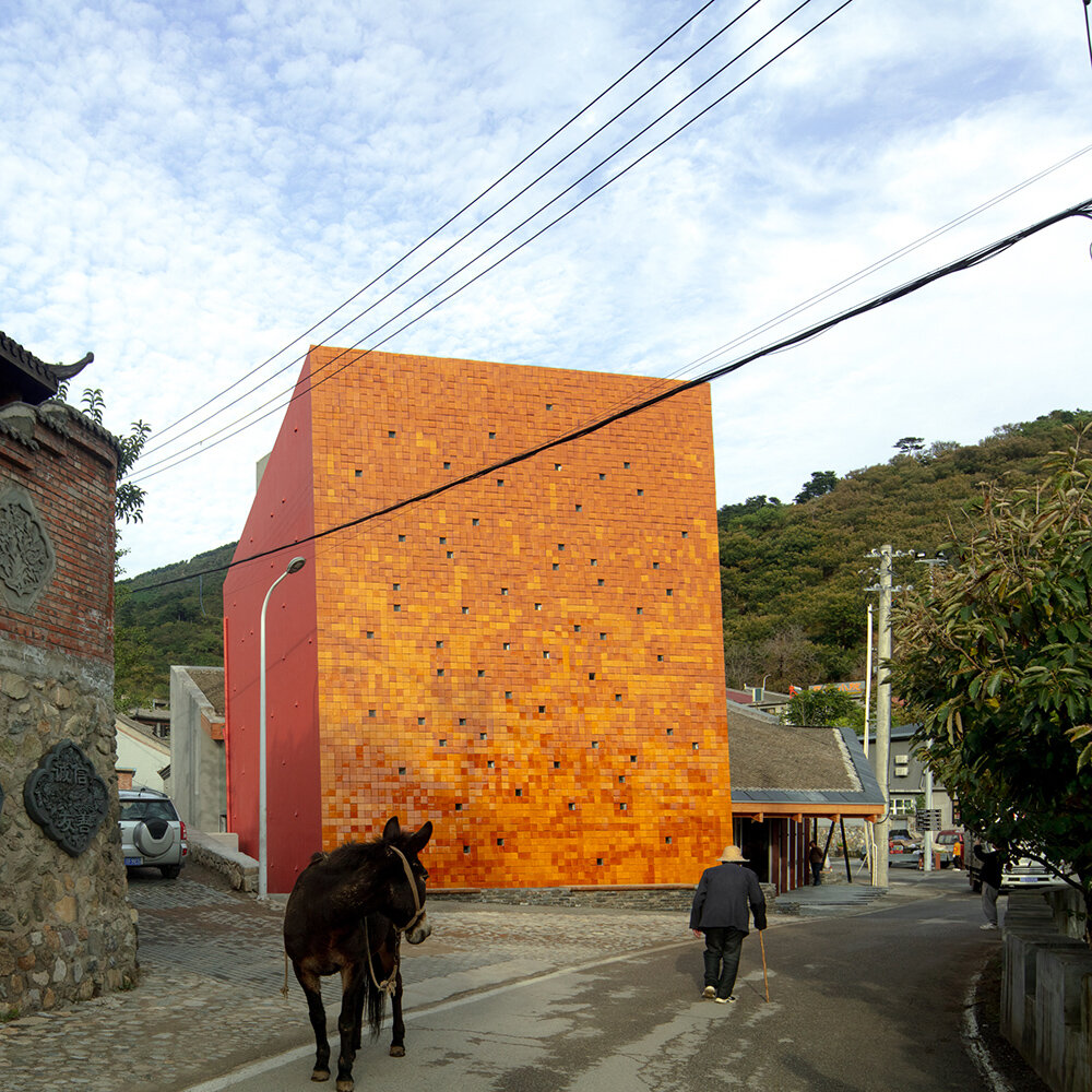 WAAAM museum's glazed yellowish tiles enliven beigou village in china