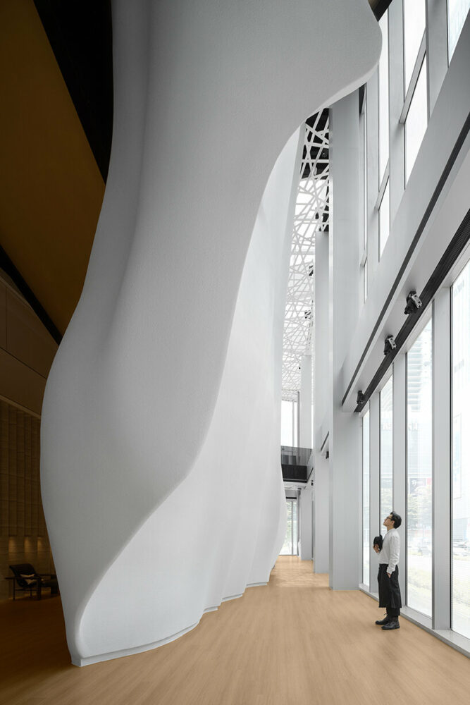 the veil: groundwork sculpts sinuous architecture like draped fabric
