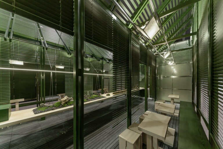 dynamic green louvers define transformative tea concept store in china