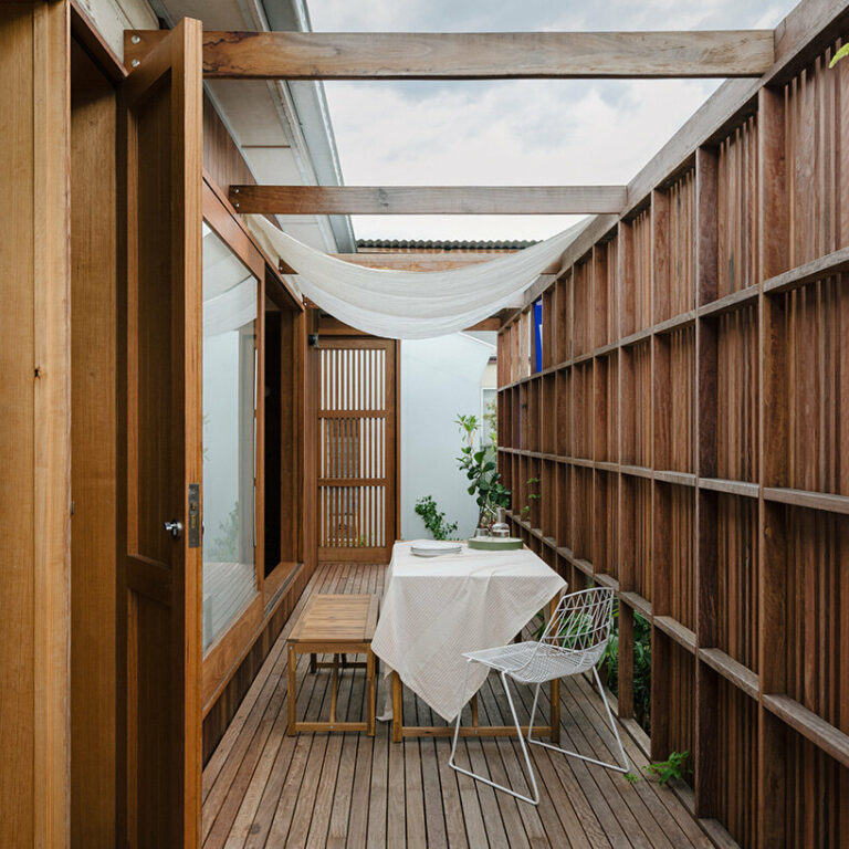 curious practice revives 'aru house' with brickwork & timber screens