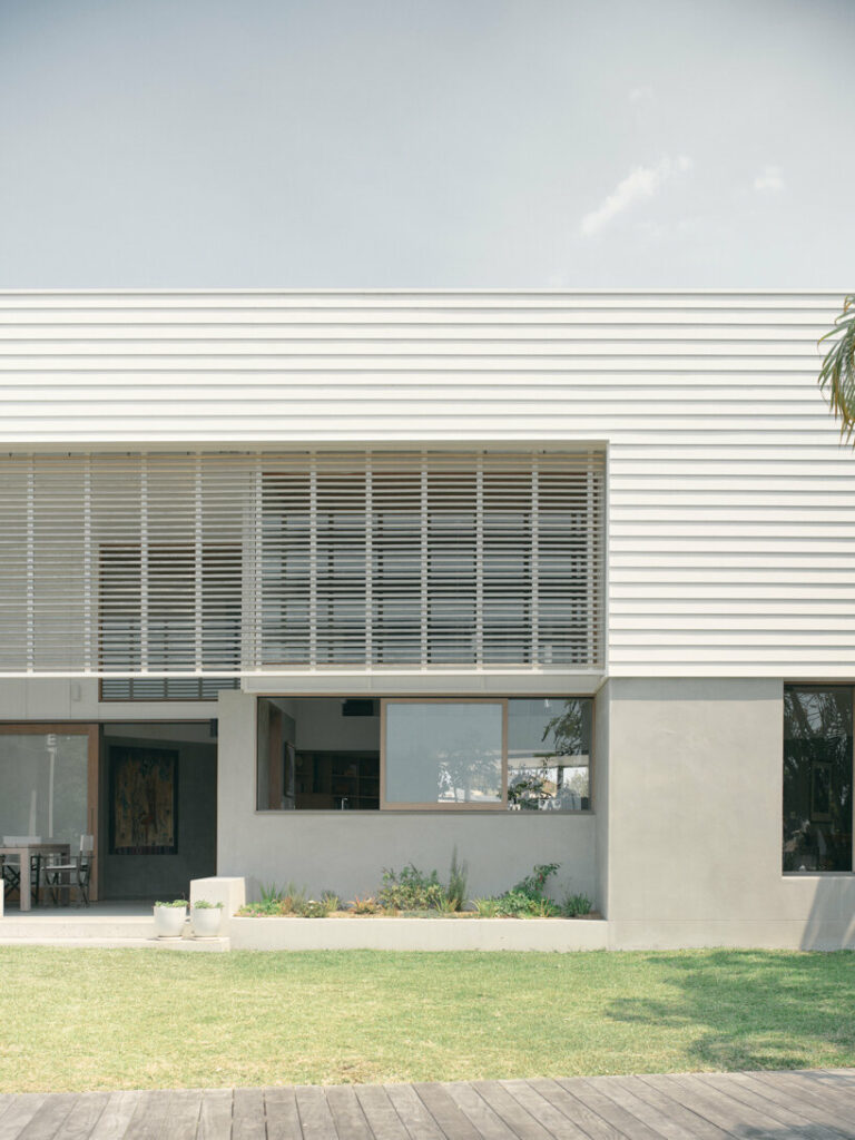 ribbed timber screens protect australian house from subtropical sun and rain