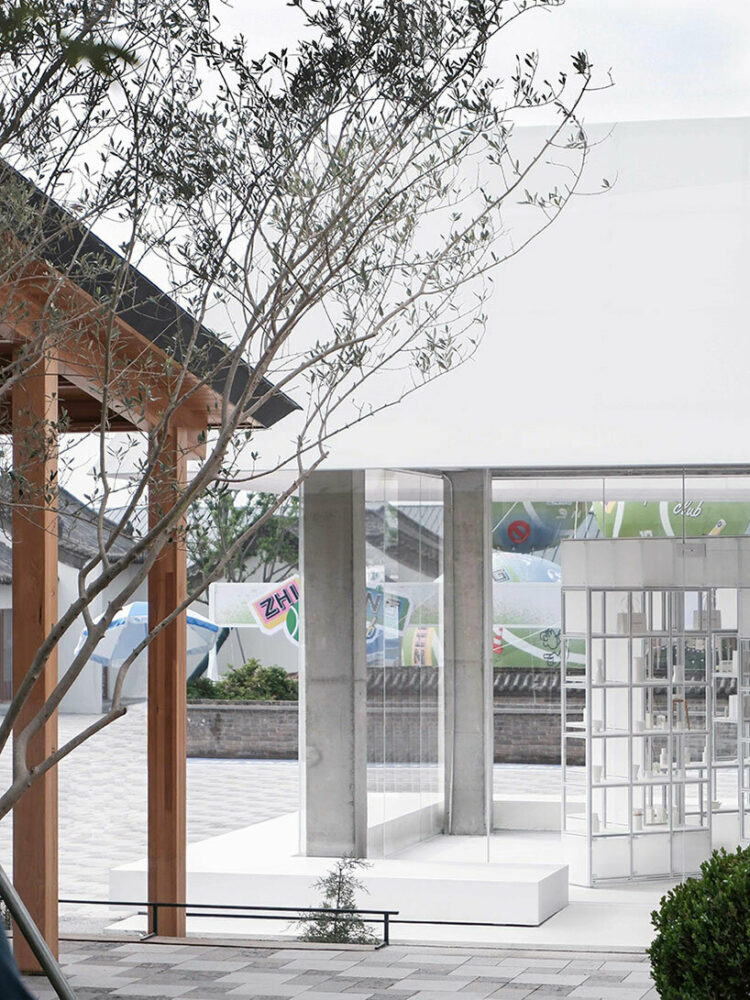 translucent pitched roof tops glass-clad store by designRESERVE in ...