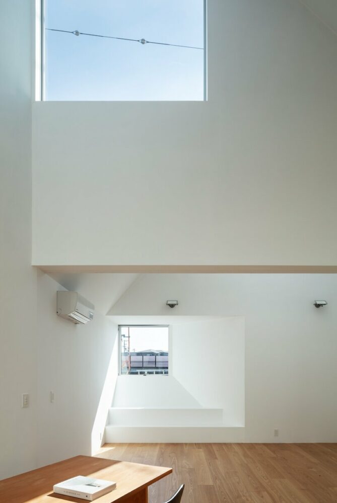sculptural saw-tooth roof tops kenji ido's white residence in japan