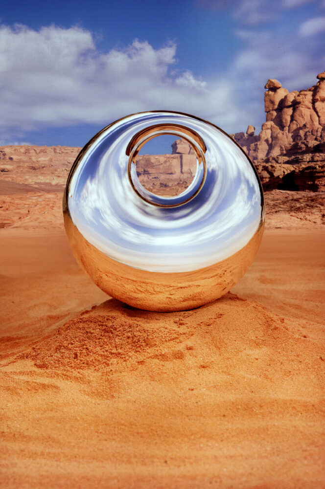 nik bentel's mathematics-inspired 'orb bag' gets a shiny finish for a warping mirror effect