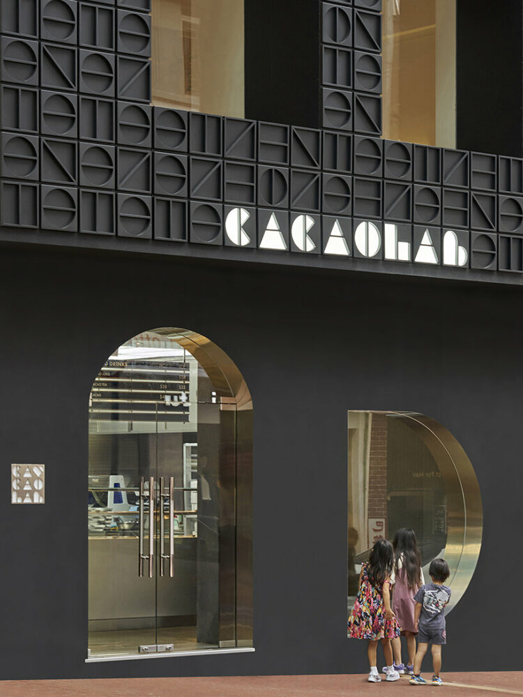other projects' monogram facade conceals new-age cacaolab flagship store in hong kong