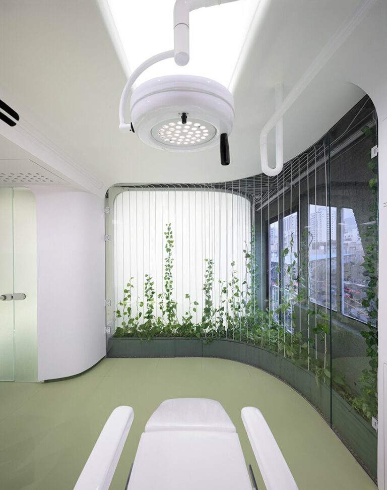 shape-shifting rod curtain and curved walls take over parkway clinic in ...