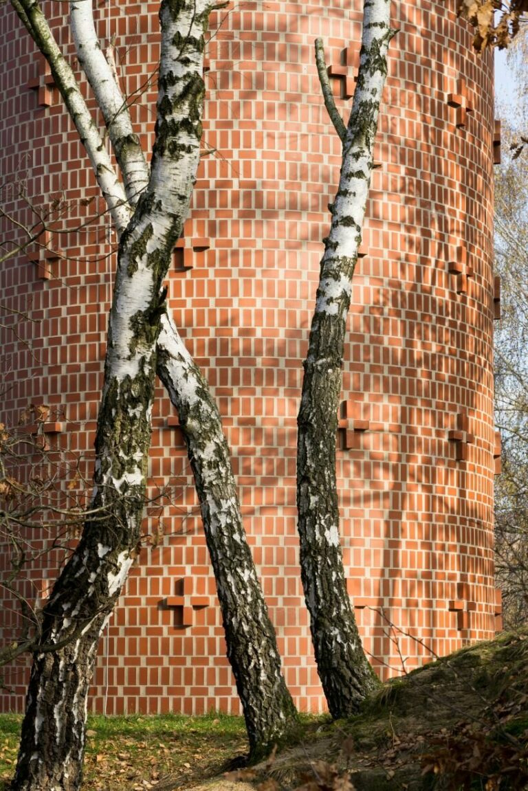 atypical gable roof replaces dome frescoes in czech brick chapel