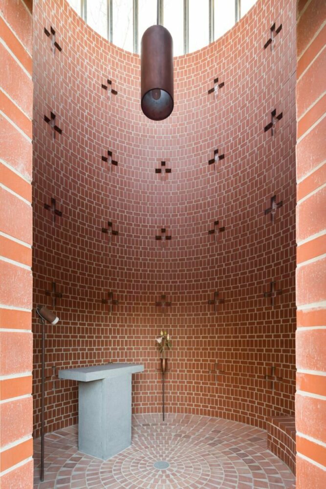 atypical gable roof replaces dome frescoes in czech brick chapel