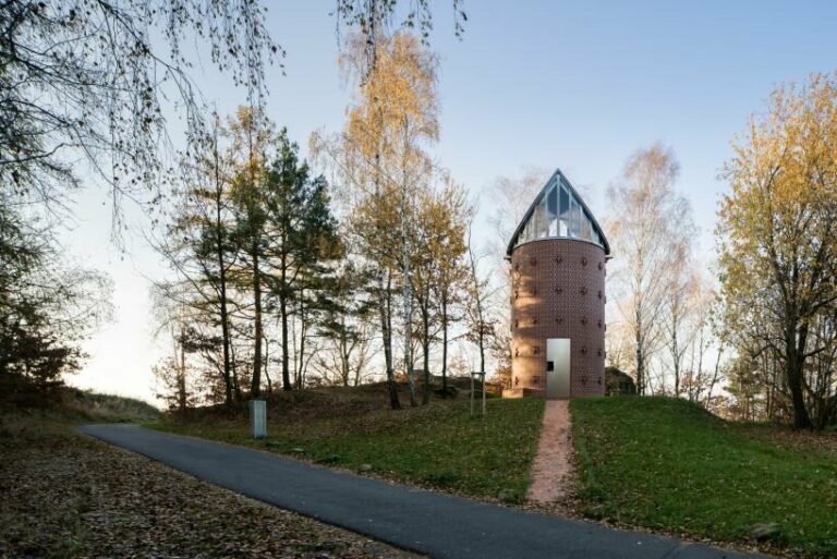 atypical gable roof replaces dome frescoes in czech brick chapel