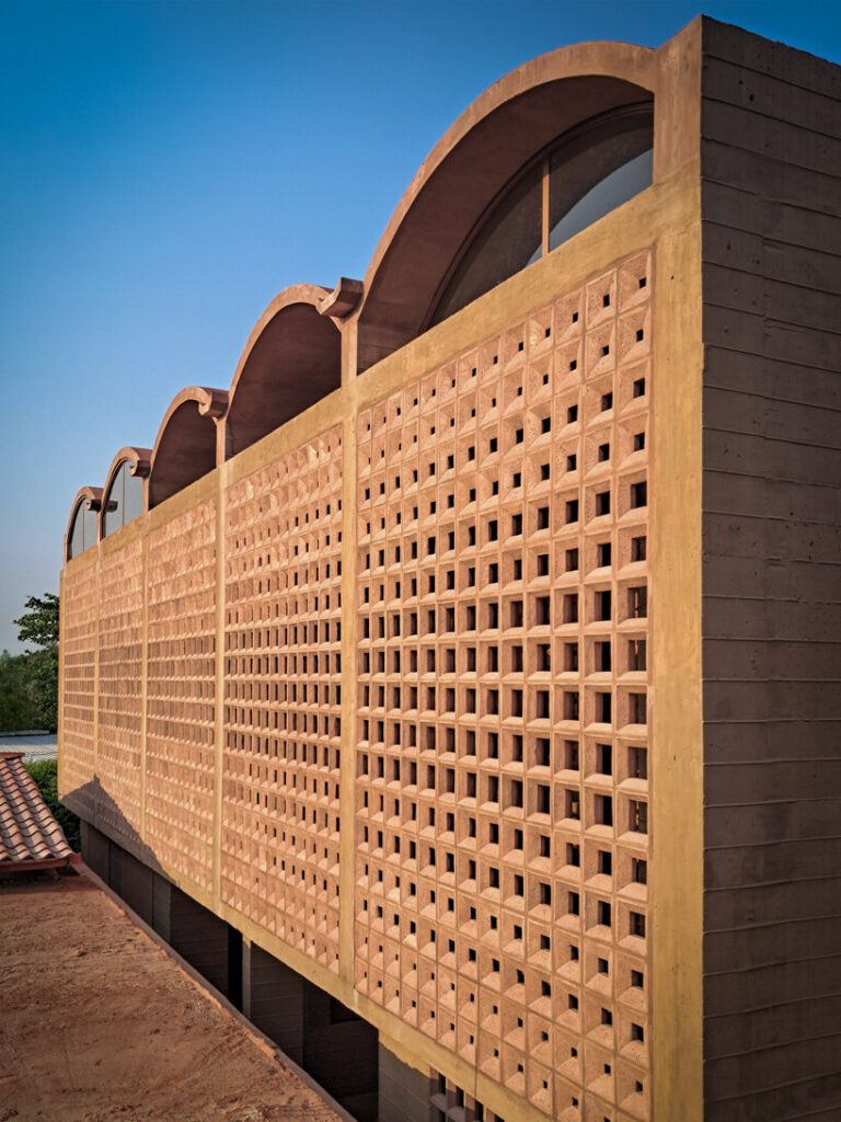 concrete lattice facade fills oaxacan community hub with shadows