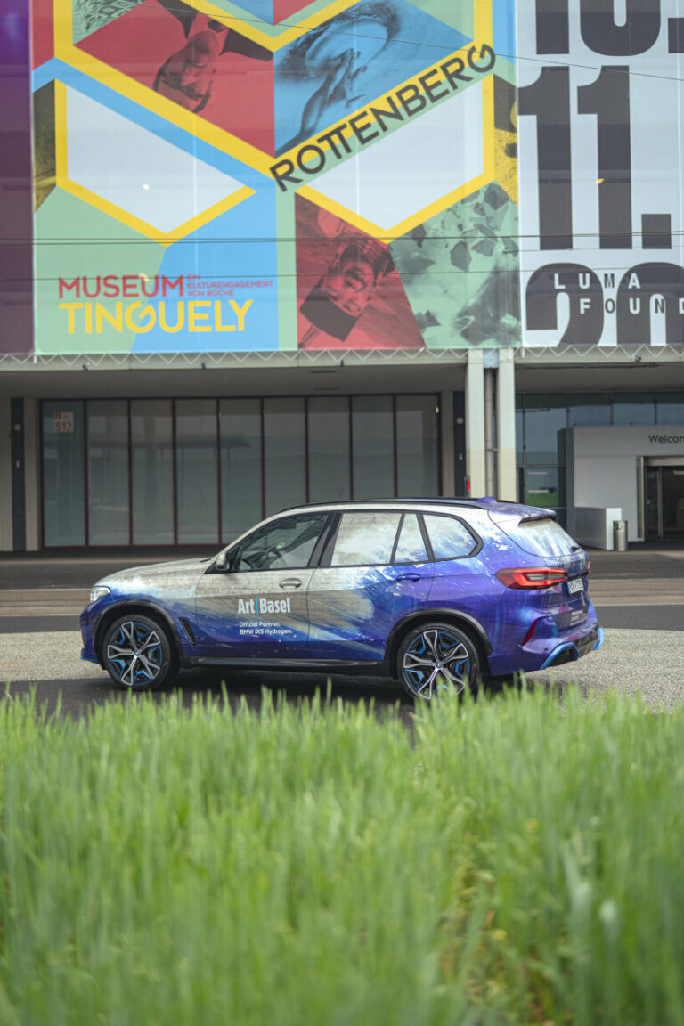 es devlin wraps BMW iX5 hydrogen in blue & white collage at art basel