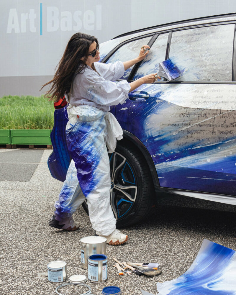 es devlin wraps BMW iX5 hydrogen in blue & white collage at art basel