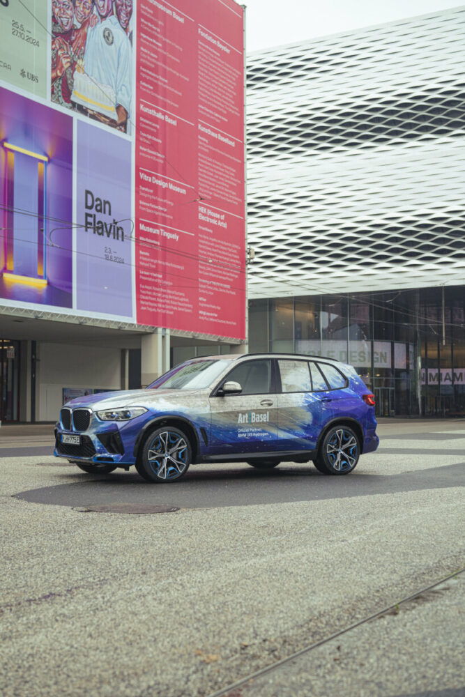 es devlin wraps BMW iX5 hydrogen in blue & white collage at art basel