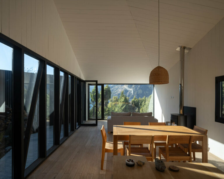 triangular courtyard slices moarqs' remote, pitch-roofed house in ...