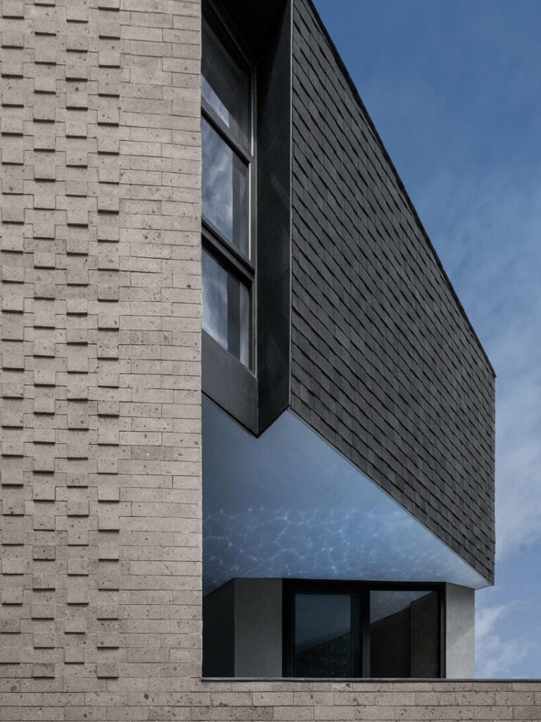 perforated adobe wall absorbs tropical heat to secure filipino residence