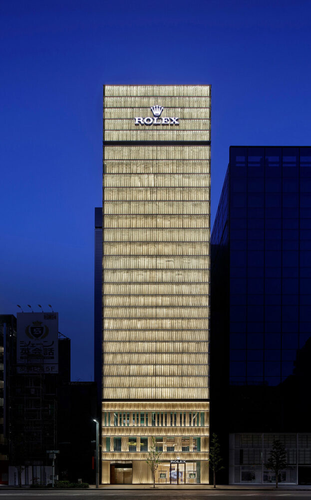 curiosity envelops rolex's ginza flagship in a double bezel pattern
