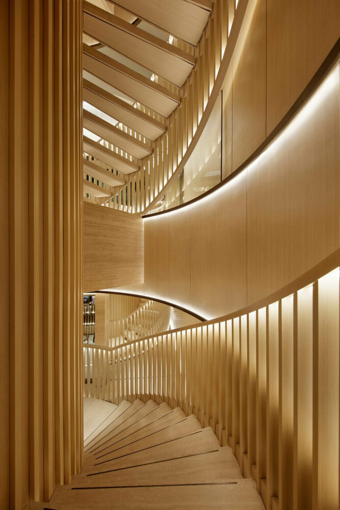 curiosity envelops rolex's ginza flagship in a double bezel pattern