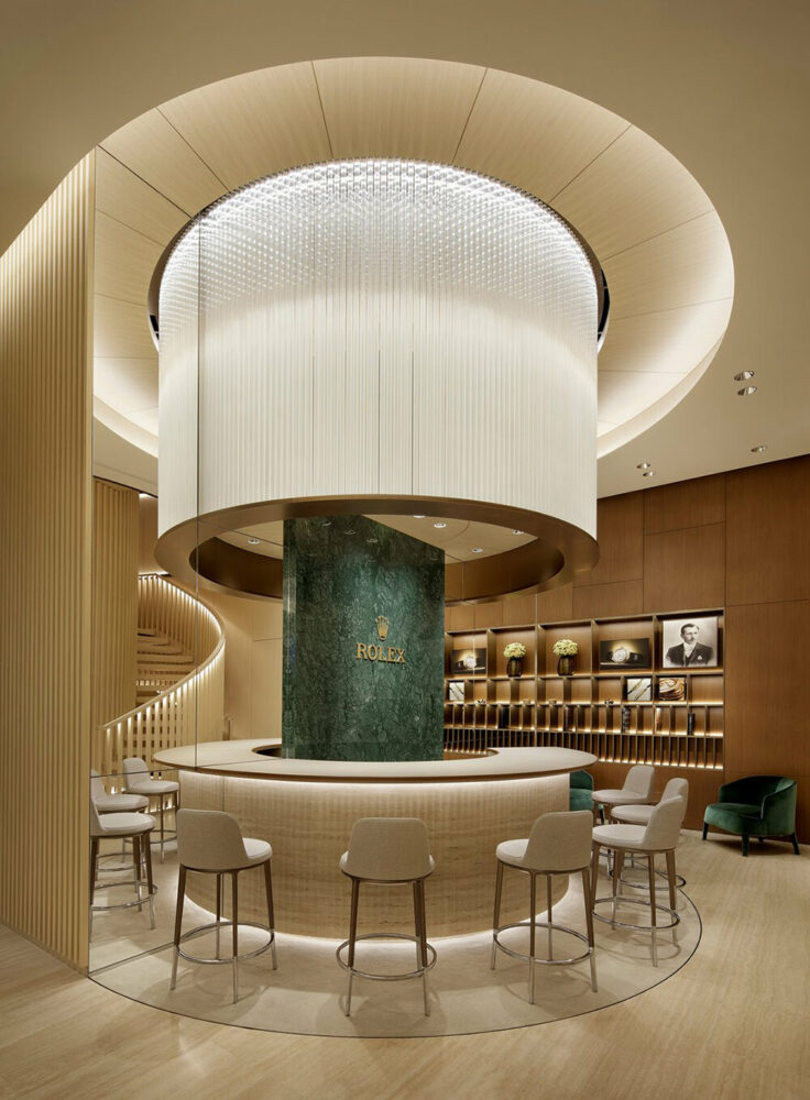 curiosity envelops rolex's ginza flagship in a double bezel pattern