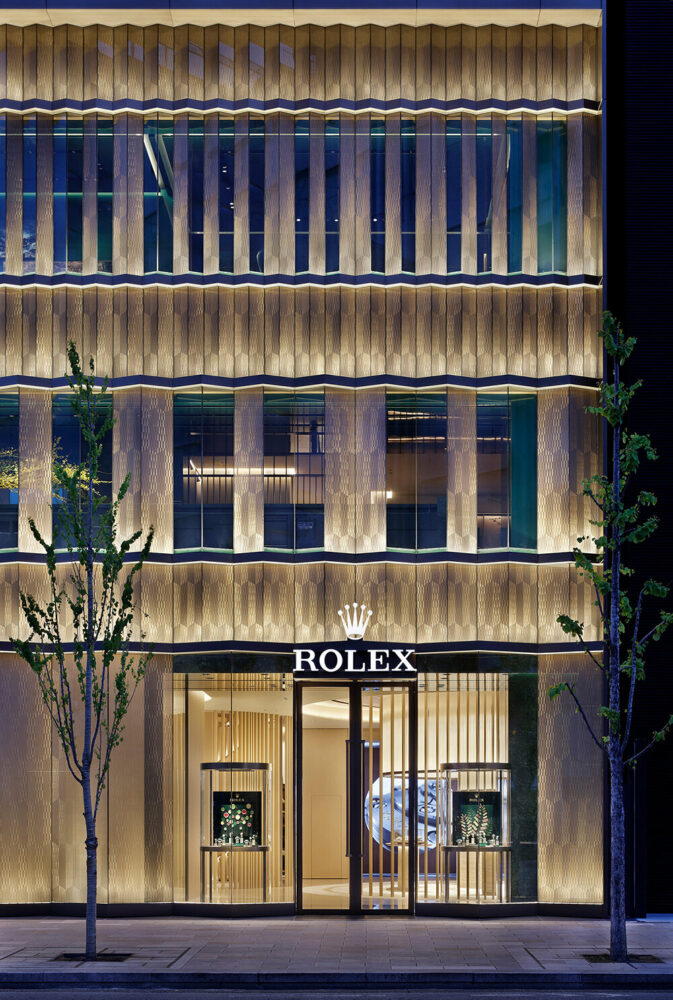 curiosity envelops rolex's ginza flagship in a double bezel pattern