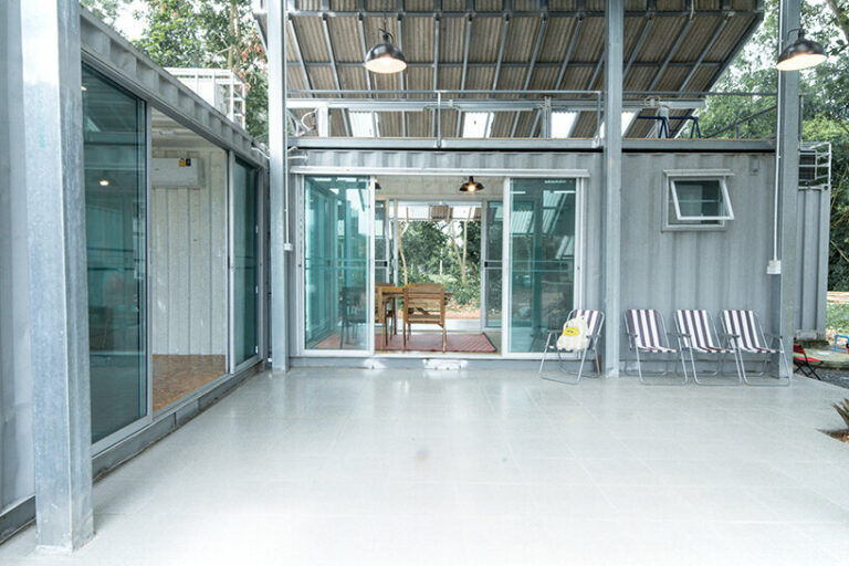 shipping containers shape prefabricated residence in thai forest