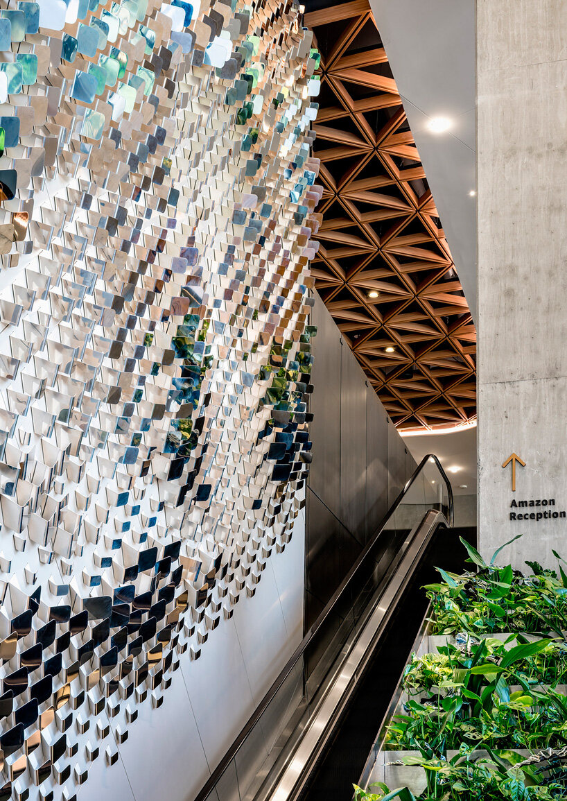 angled mirrored surfaces form silver lining installation by rob ley