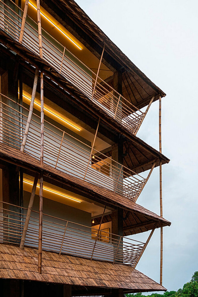 BLOOM screens girl dormitory's concrete skeleton with woven bamboo skin