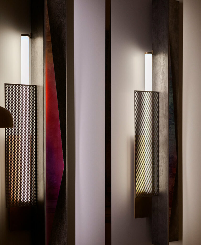 colorful mirrored planes of wall lamp by tarek dada cast transformative ...