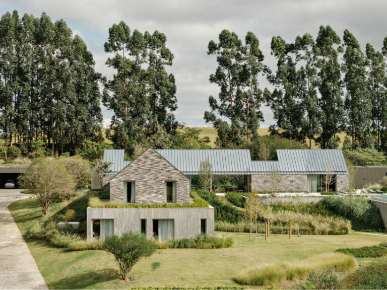 gable roof openings illuminate internal gardens within barn house in brazil