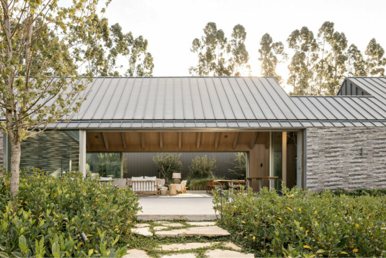 gable roof openings illuminate internal gardens within barn house in brazil
