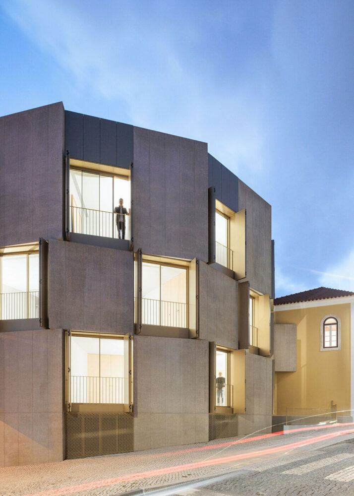 concrete panels overlap across didier faustino's mártires housing complex