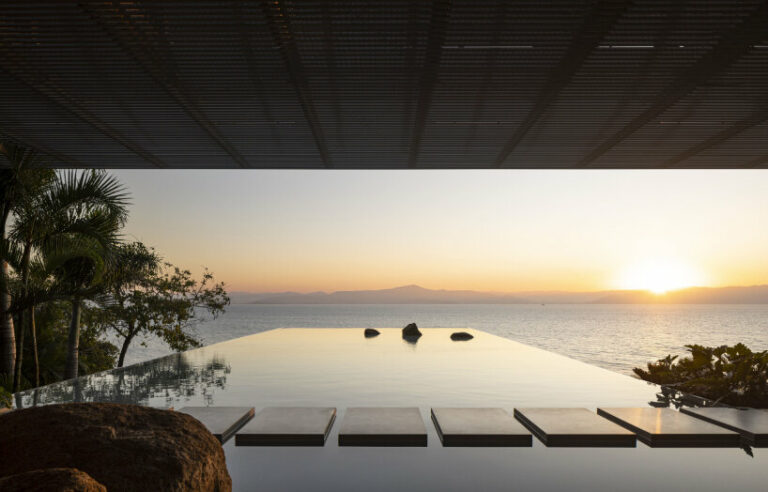 with a suspended infinity pool, tetro's ponte house hangs from the ...