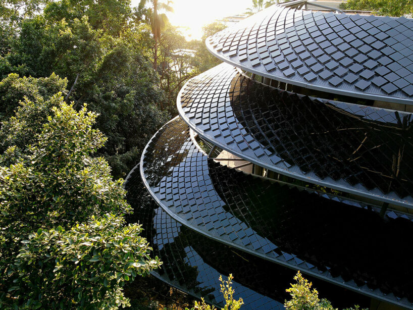 curvilinear solar roofs outline this positive energy house in shenzhen