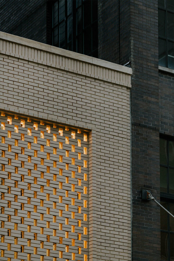 brick-screen facade highlights leica store & gallery in revitalized ...