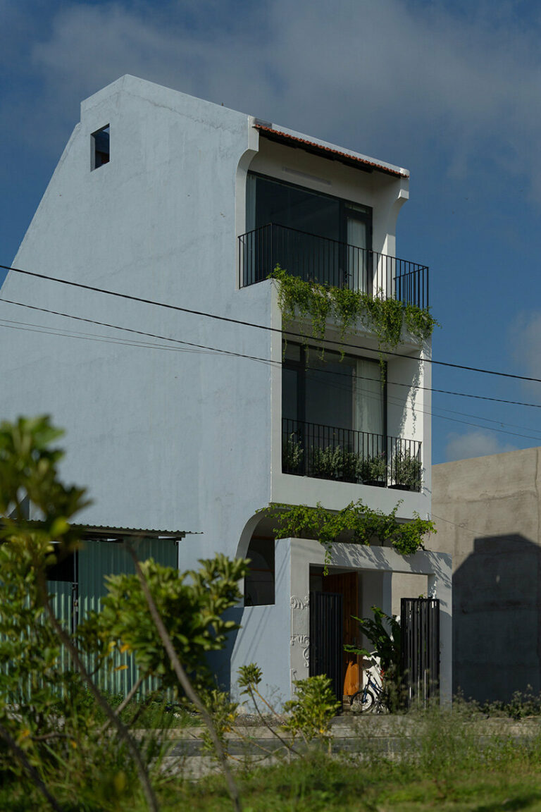 dual facades and central skylight illuminate dat tran's residence in western vietnam