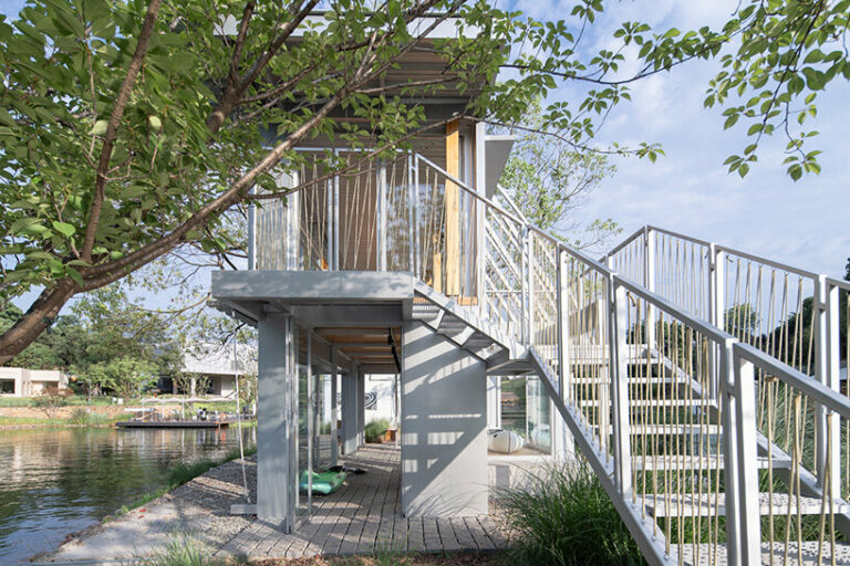 tree canopies shade lakeside commercial hub by YIIIE architects in chengdu