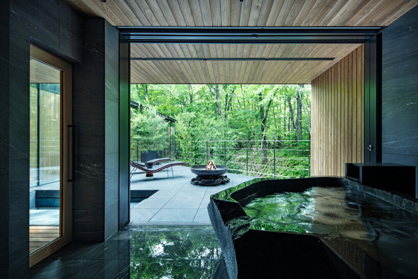 NOT A HOTEL KITAKARUIZAWA IRORI blends wood & glass in japanese forest