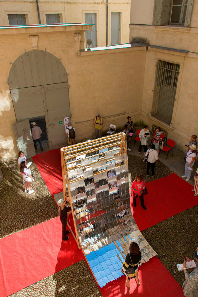 kinetic mirror pavilion's living facade reflects french monument for ...