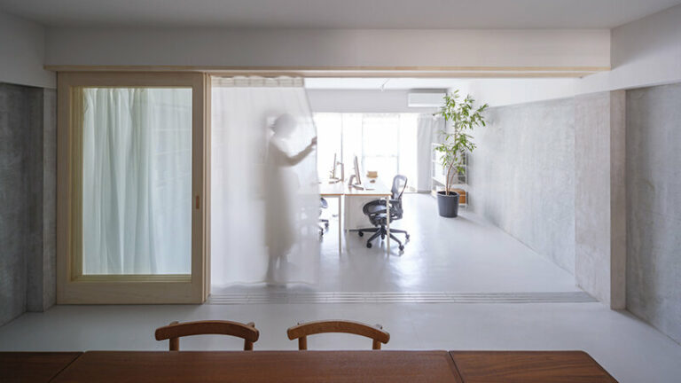 adaptable fabric partitions divide raumus' renovated soft workspace in ...