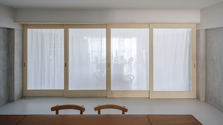 adaptable fabric partitions divide raumus' renovated soft workspace in ...