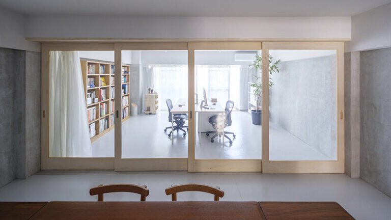 adaptable fabric partitions divide raumus' renovated soft workspace in ...