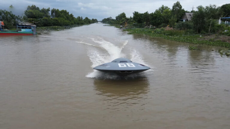 functional UFO jet boat zooms through water as a motorized flying ...