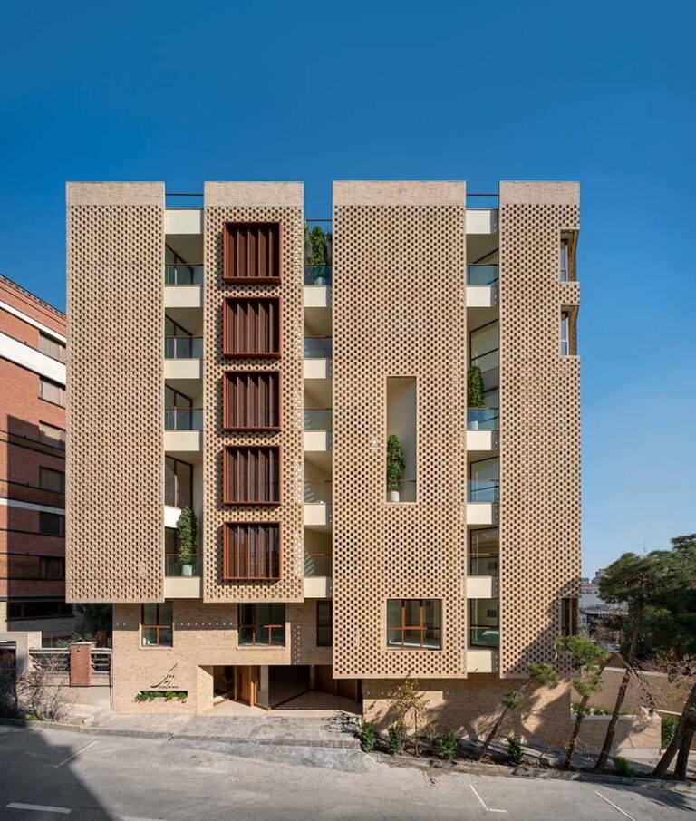 brick-layered facade shields zendegi building from harsh sunlight in tehran