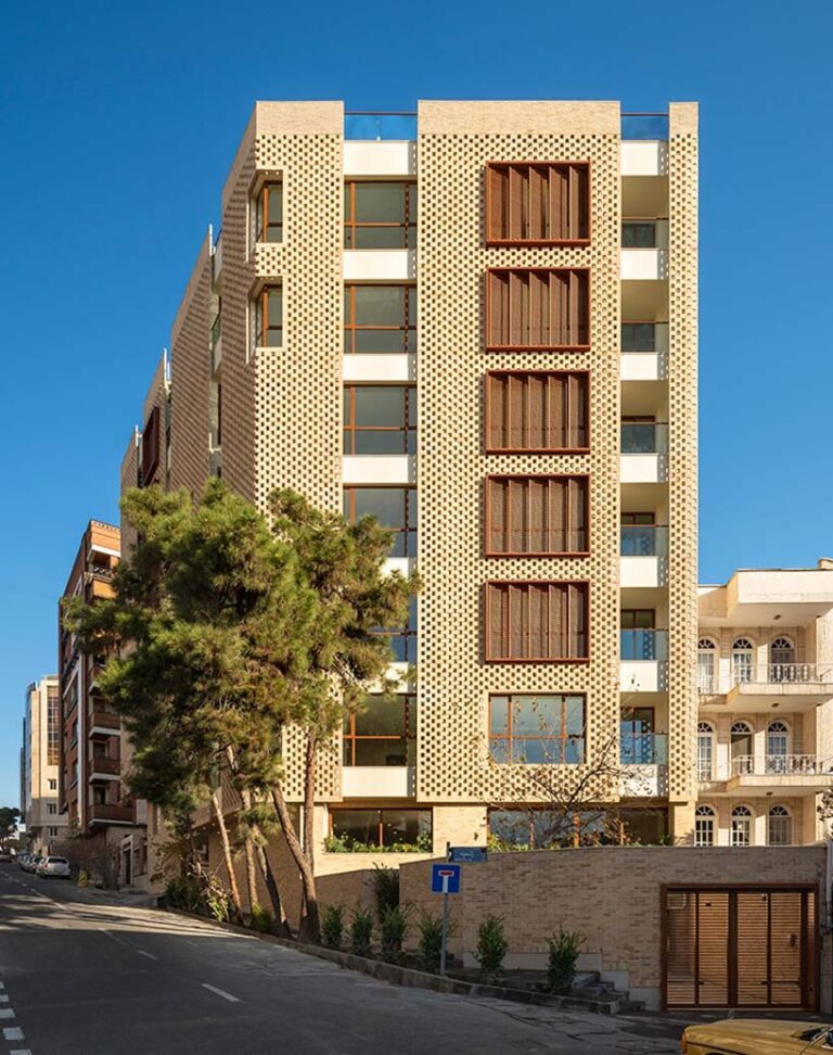 brick-layered facade shields zendegi building from harsh sunlight in tehran