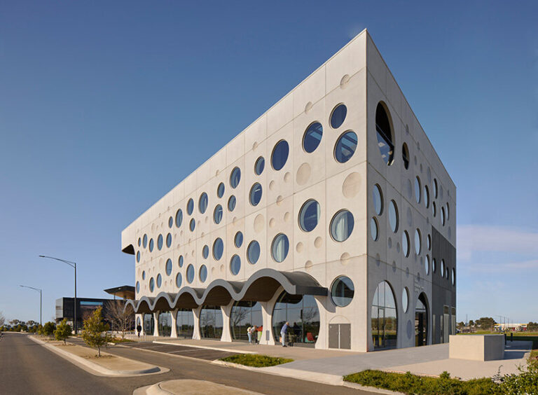 playful, circular windows punctuate buchan's library expressive facade ...