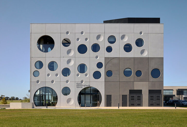 playful, circular windows punctuate buchan's library expressive facade ...